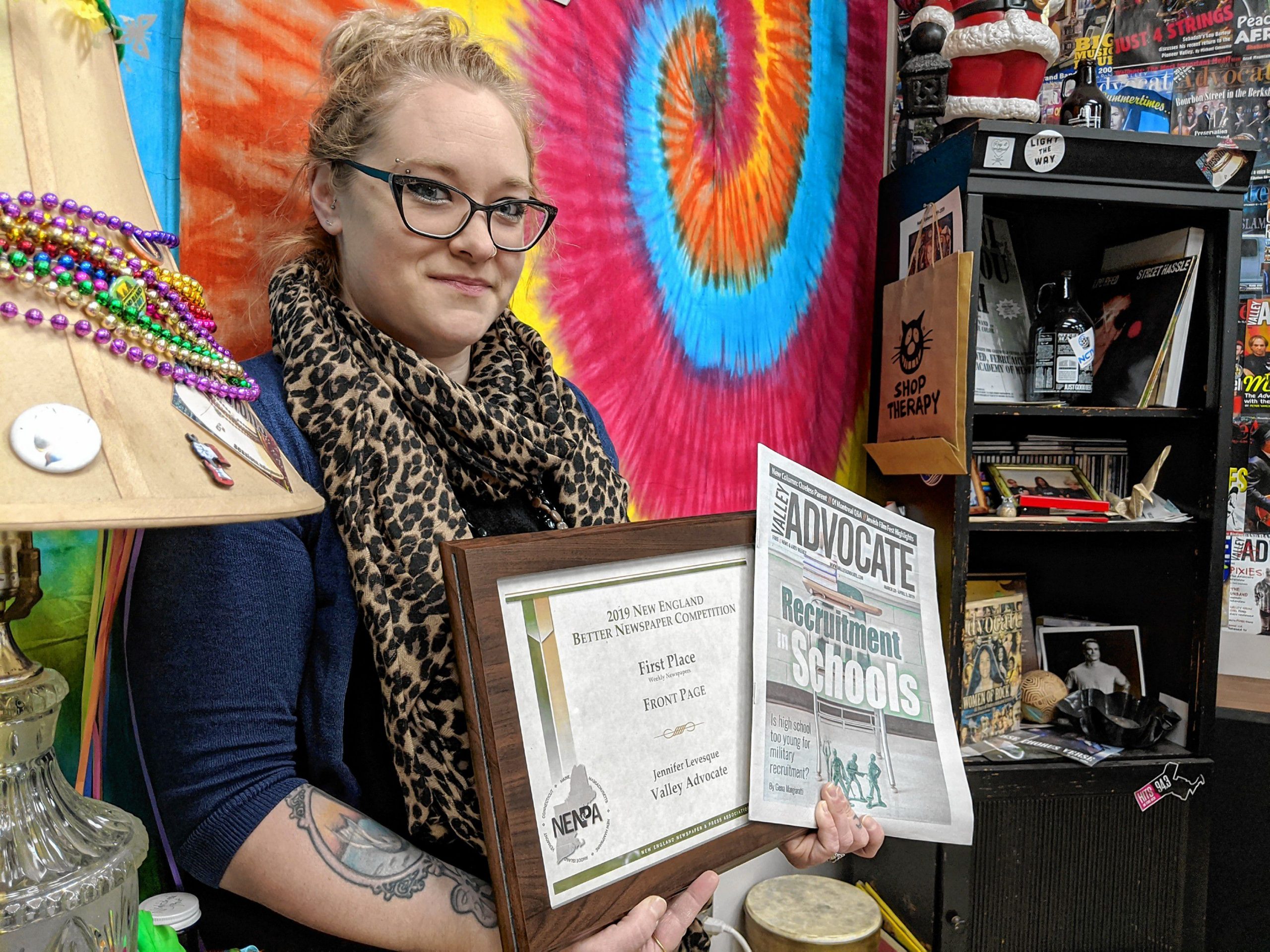 Jen Levesque displaying her first place plaque for her award in the ...